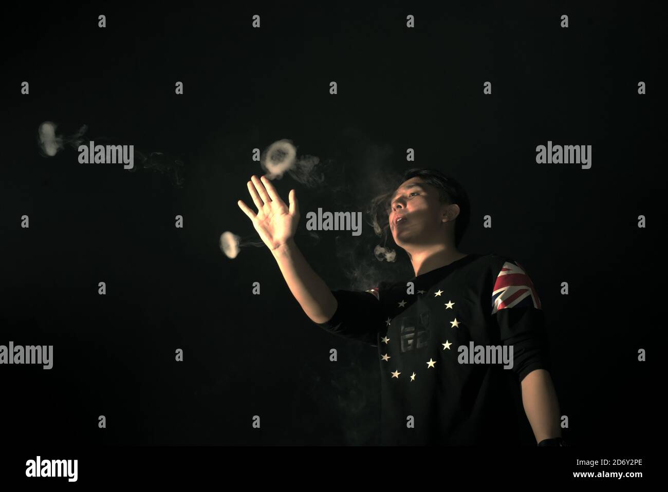 A vape cloud performer demonstrating some of his tricks inside a vape ...