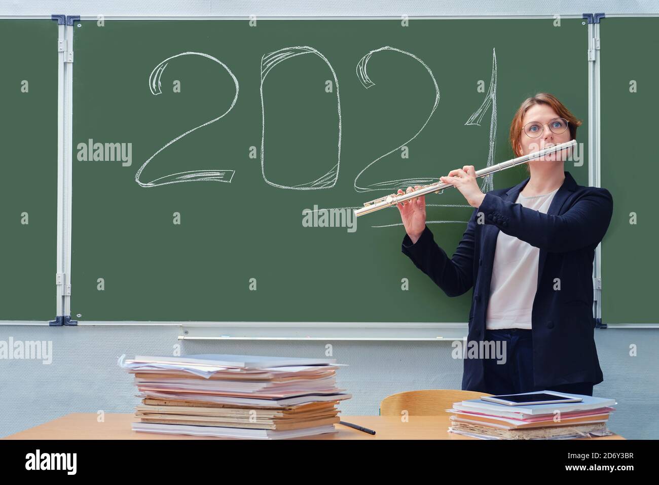 A music teacher plays a musical instrument on the background of a ...
