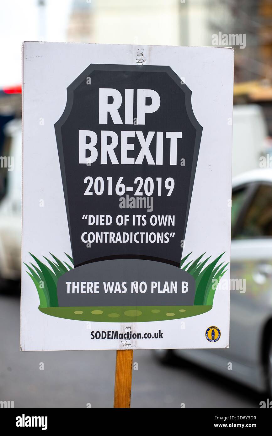 Anti-Brexit campaign poster being used by protesters outside the Houses ...