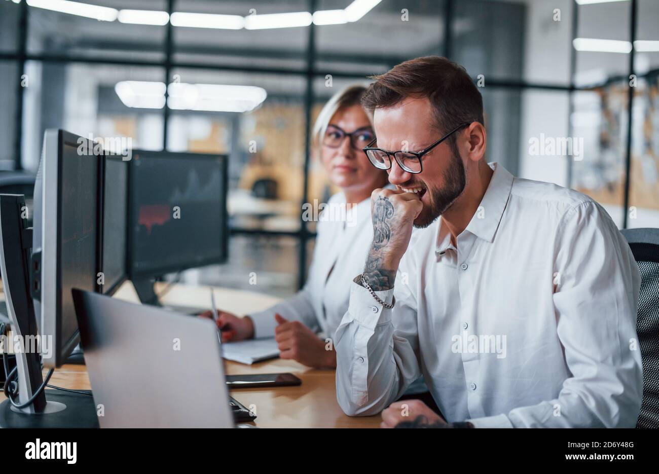 Worried face expression. Two stockbrokers in formal clothes works in ...