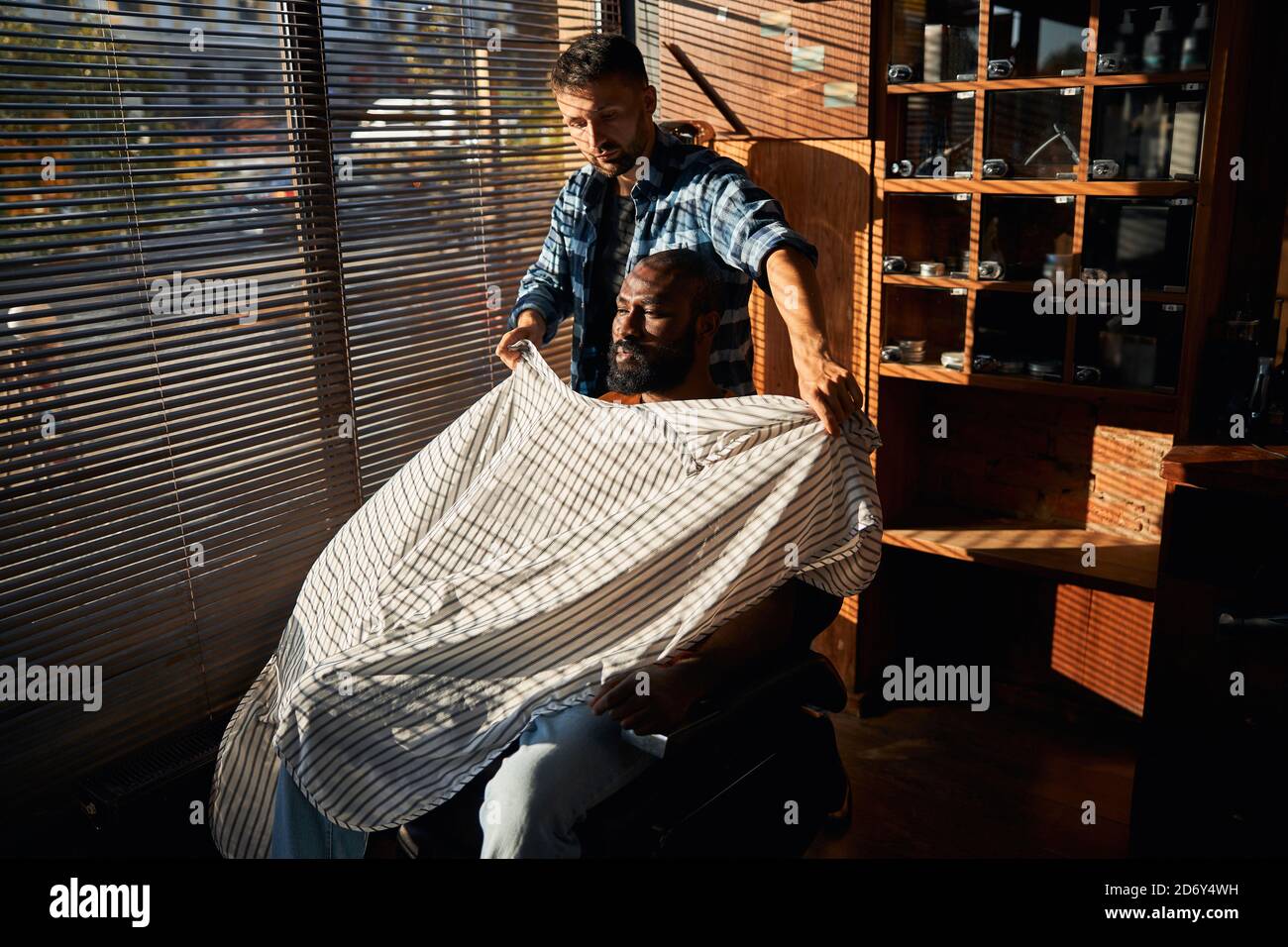 Hairdressing cape hi-res stock photography and images - Alamy