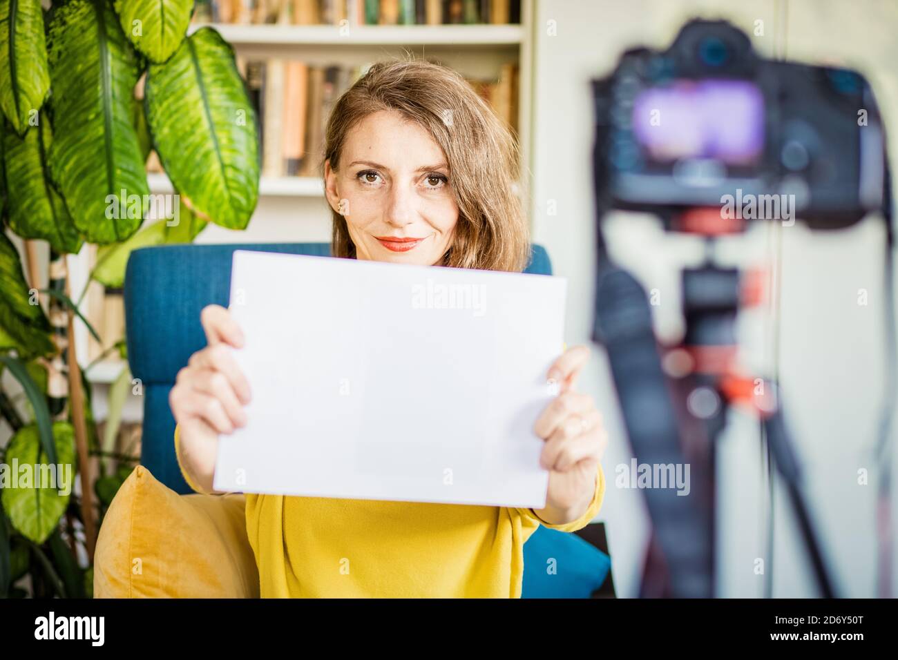 teacher or vlogger recording a lesson on camera online learning Stock ...