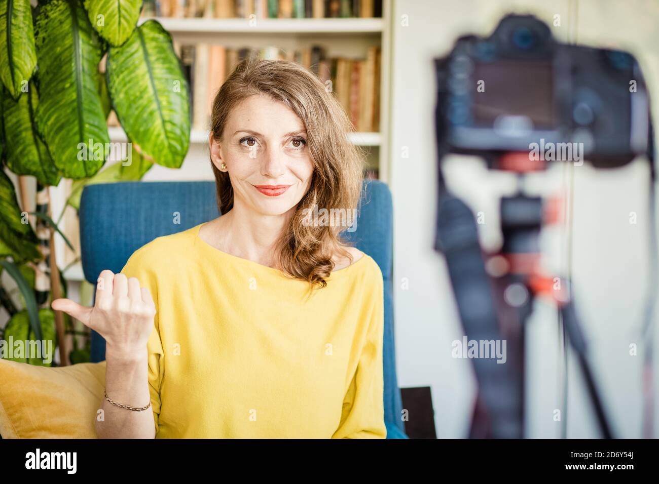 teacher or vlogger recording a lesson on camera online learning Stock ...