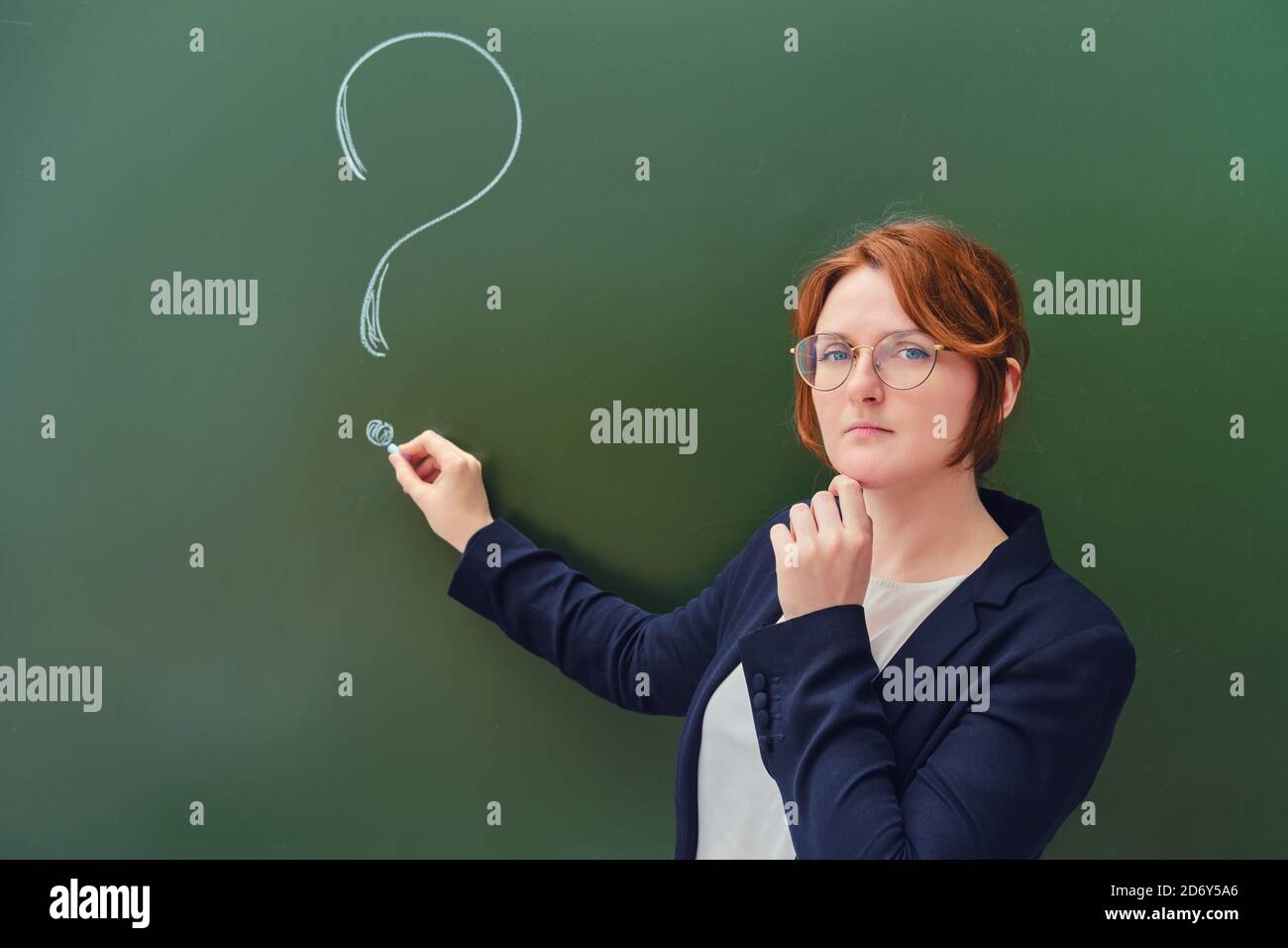 Teacher drew a question mark in chalk on a blackboard, copy space on ...
