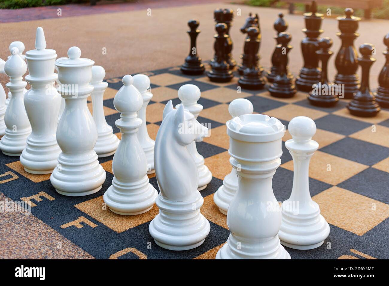Outdoor chess board with big plastic pieces. Giant size chess in public ...