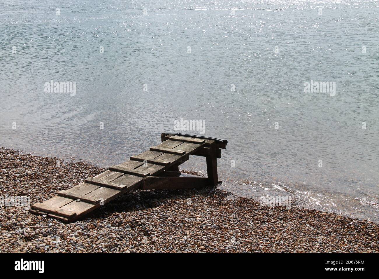 A Wooden Landing Stage from a Beach to a Boat Stock Photo - Alamy