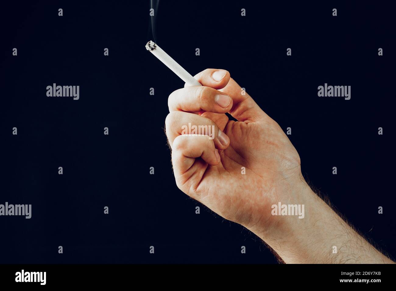 Cigarette against black background hi-res stock photography and images ...