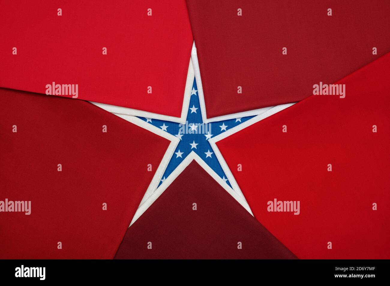 Fat quarters of fabrics red and white colors lying in the shape like a ...