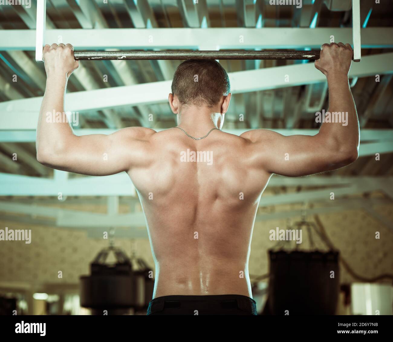 young sportive man making push-ups from sport equipment Stock Photo - Alamy