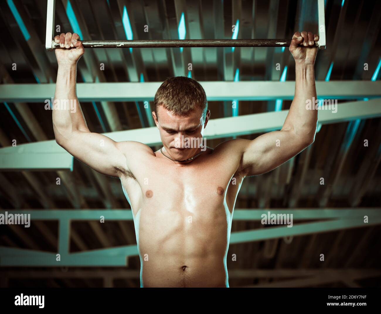 young sportive man making push-ups from sport equipment Stock Photo - Alamy