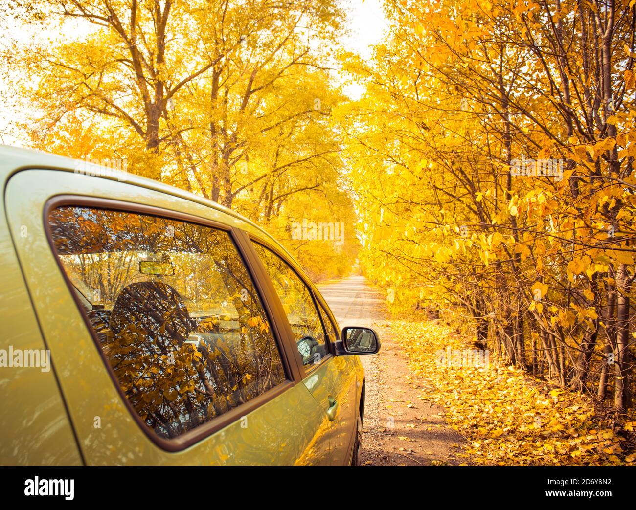 car on rural fall season road Stock Photo - Alamy