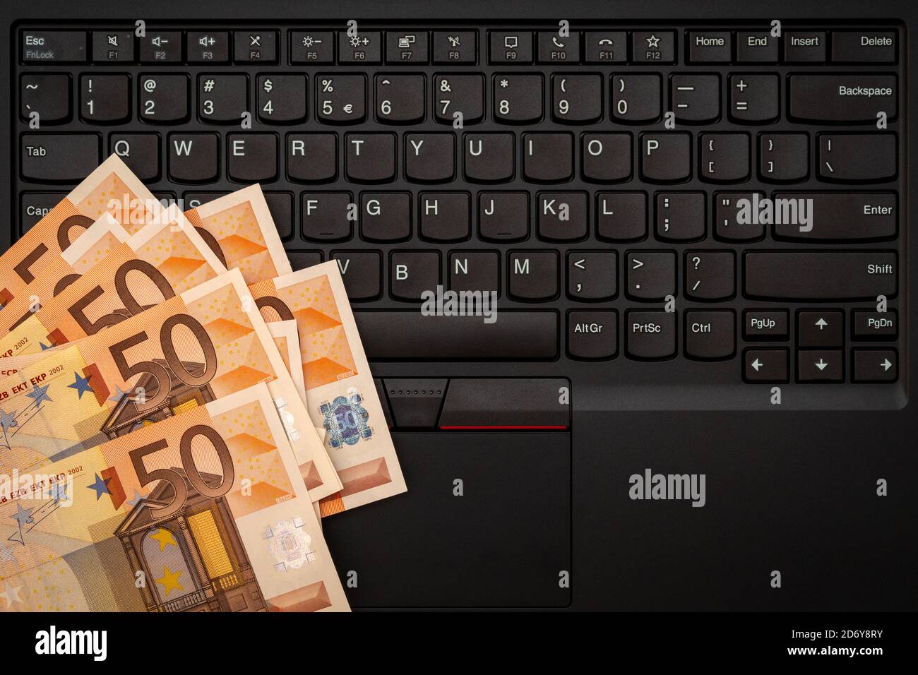 Money cash banknote on laptop keyboard, digital money and e-commerce ...
