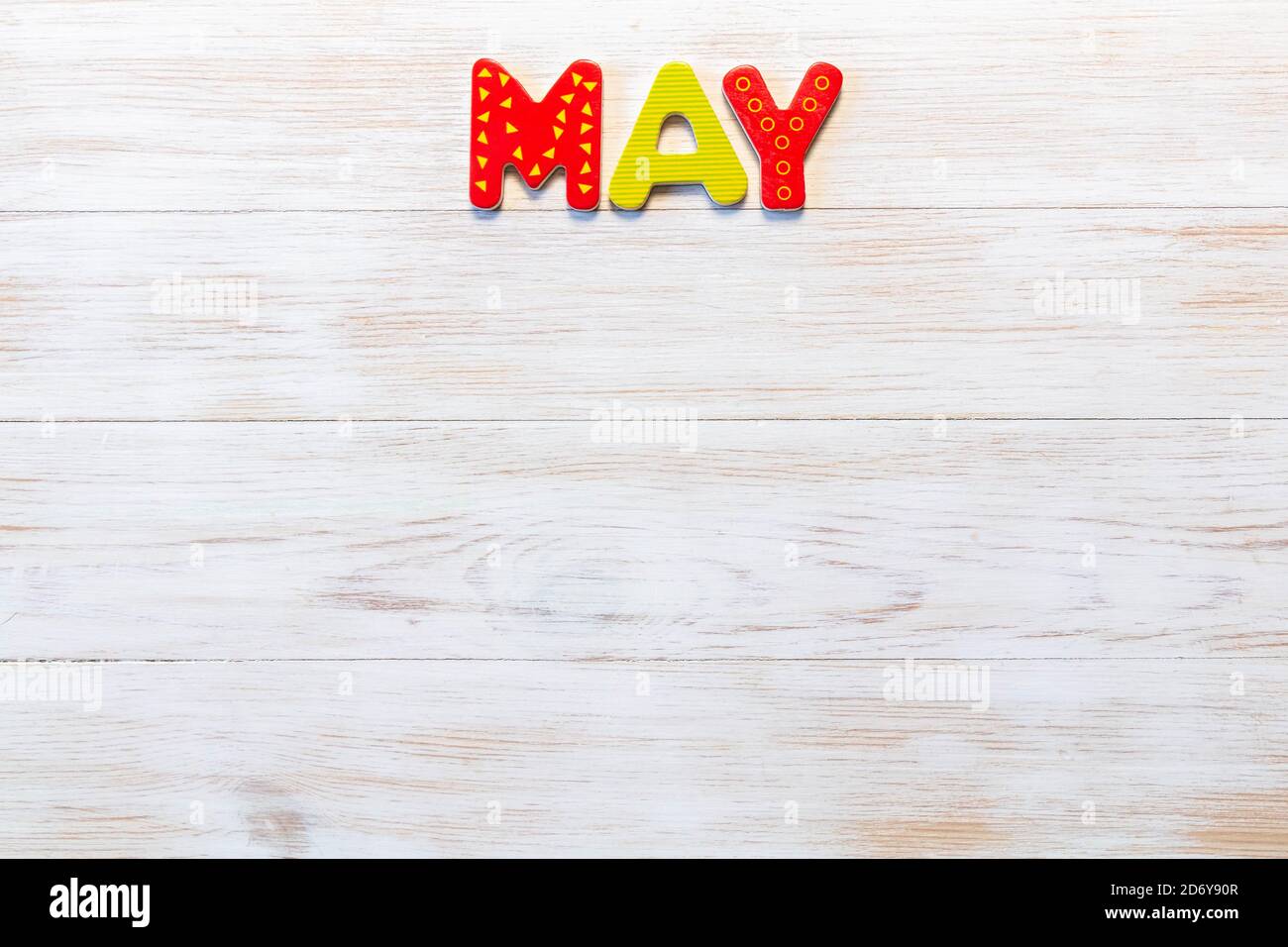Wooden letters written May month on vintage background. Inscription May ...