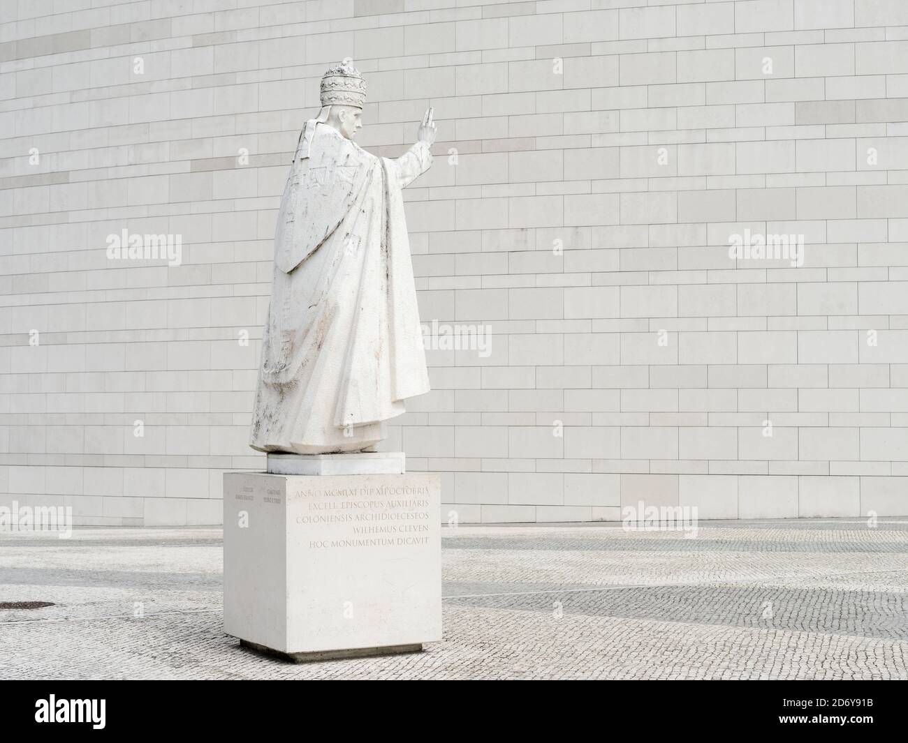 Statue of pope Pius XII in front of the wall of the basilica of the ...