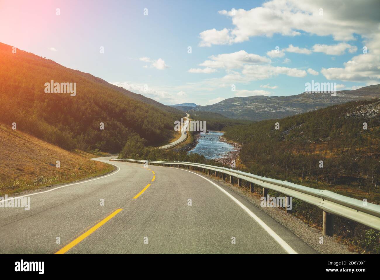 Driving a car on mountain winding road. Road along mountain river ...
