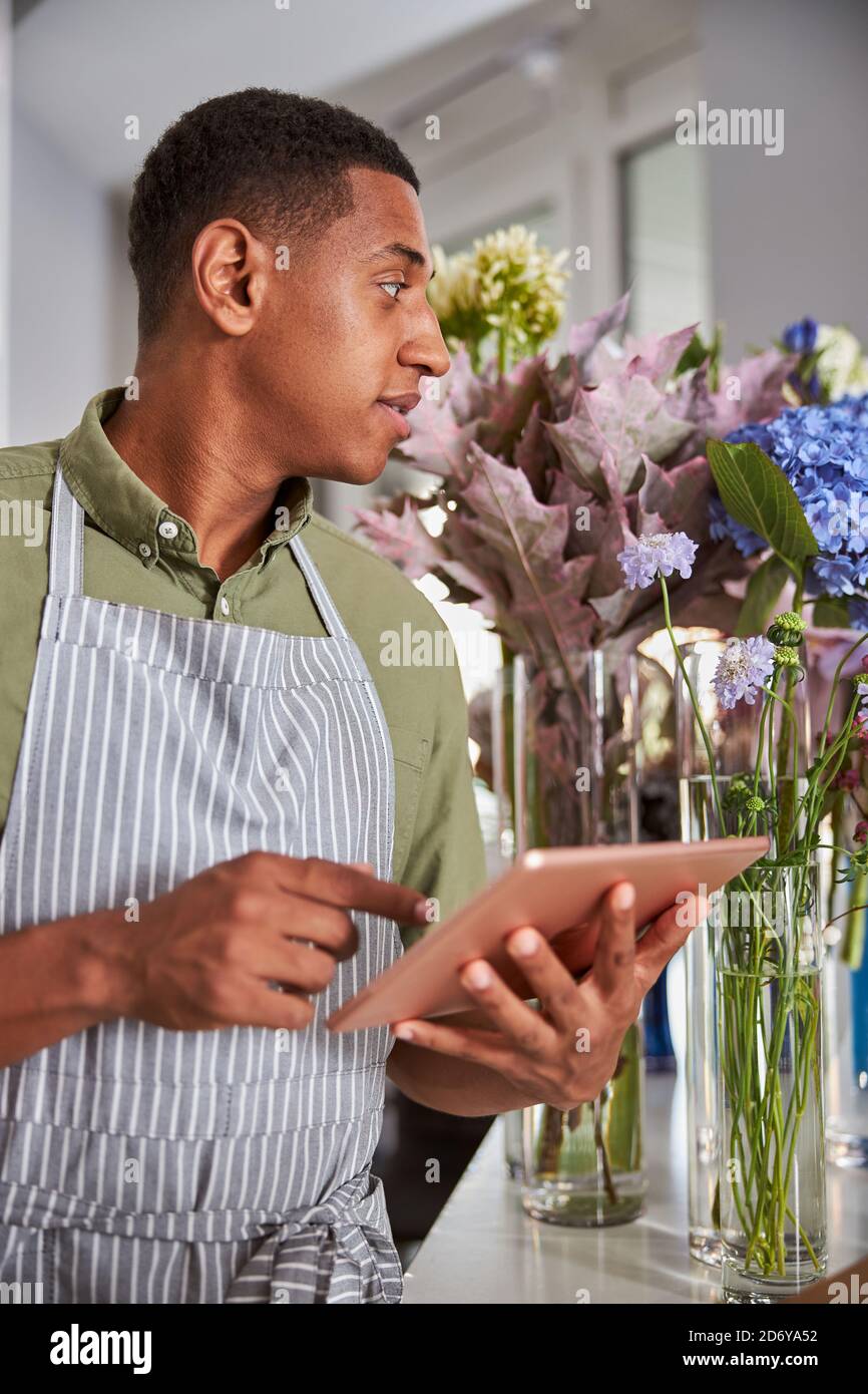 Cheerful guy tablet working hi-res stock photography and images - Alamy