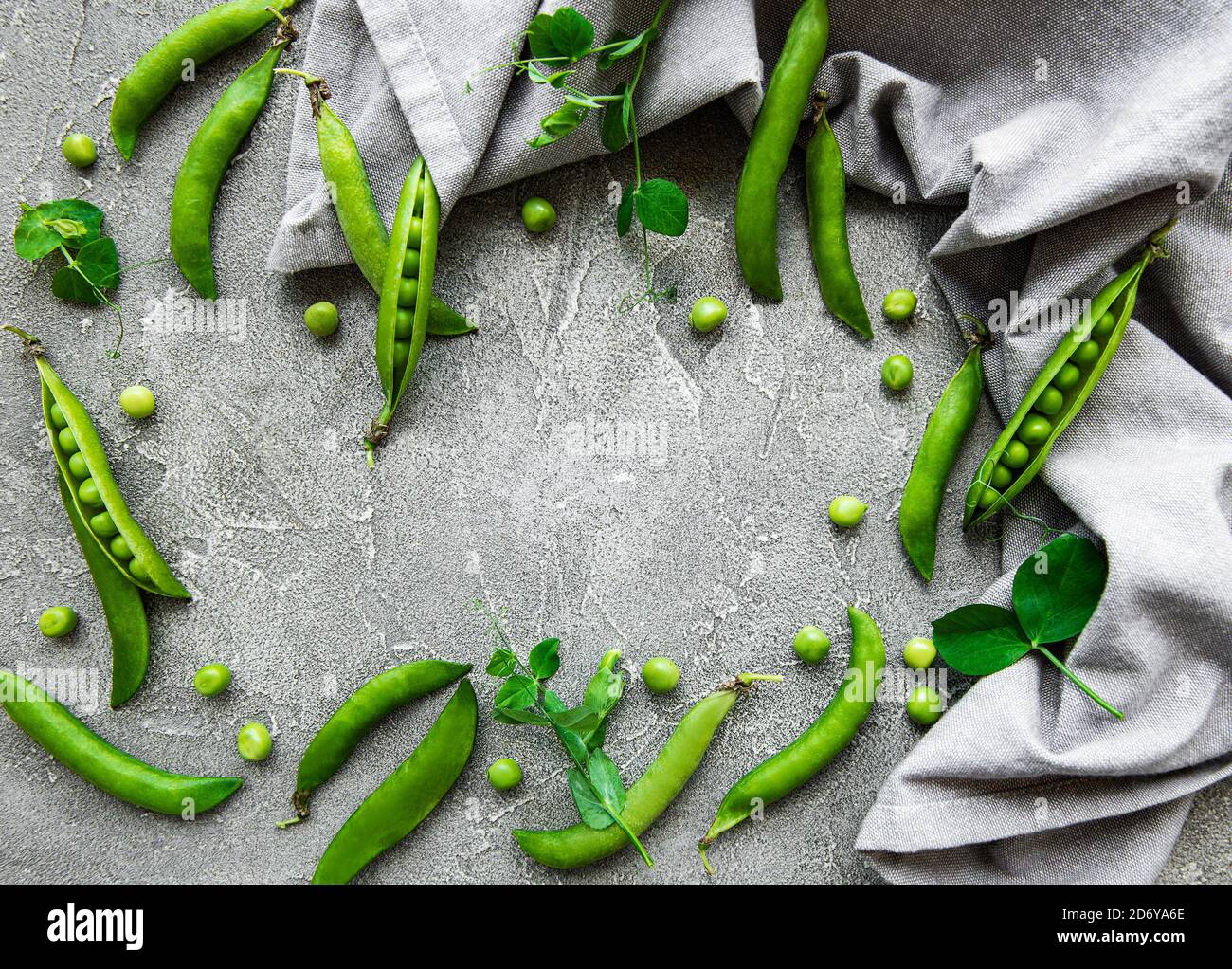 Pods of green peas on a concrete background. Organic food Stock Photo ...