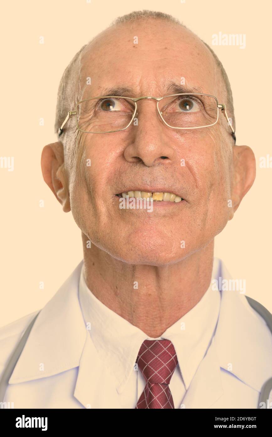 Professional doctor elderly thinking hi-res stock photography and ...