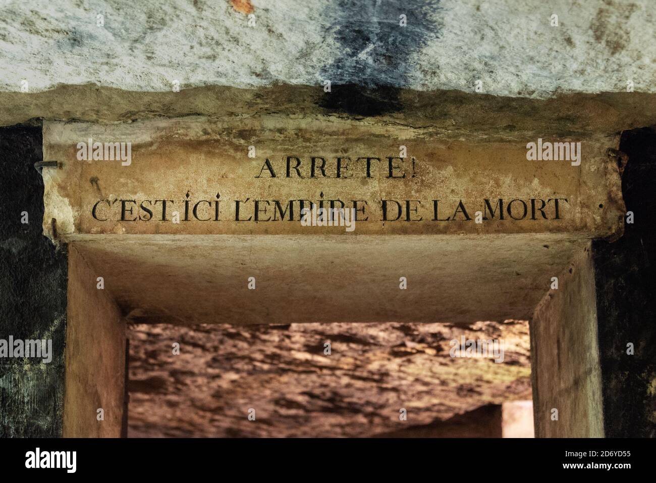 Entrance door of the catacombs of Paris, France. Text in French meaning ...