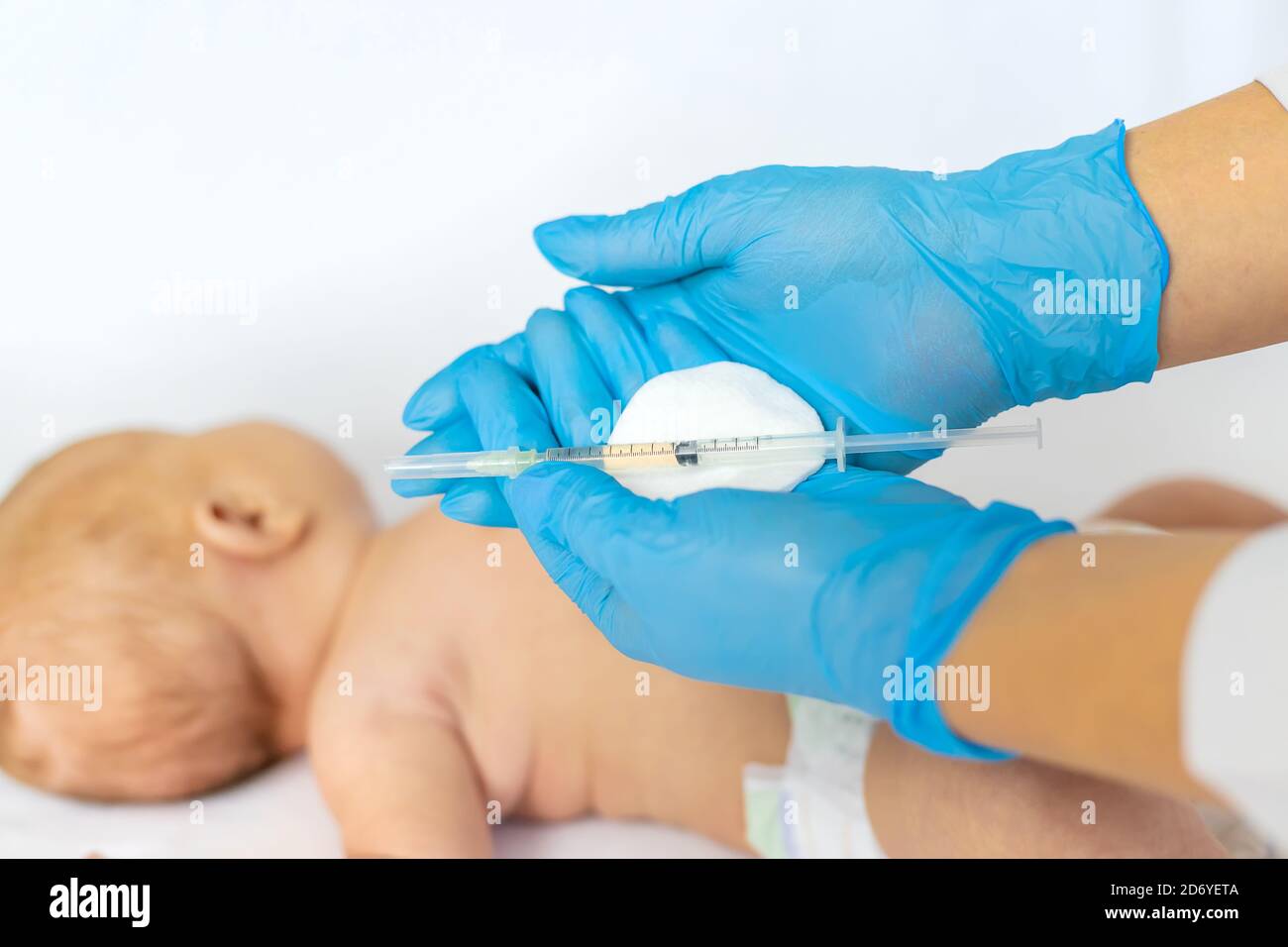 Vaccination baby, injection in the arm. Selective focus. People Stock ...
