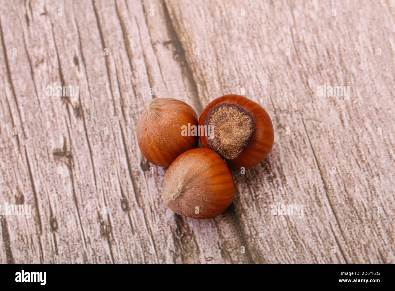 Hazelnut heap isolated over natural background Stock Photo - Alamy