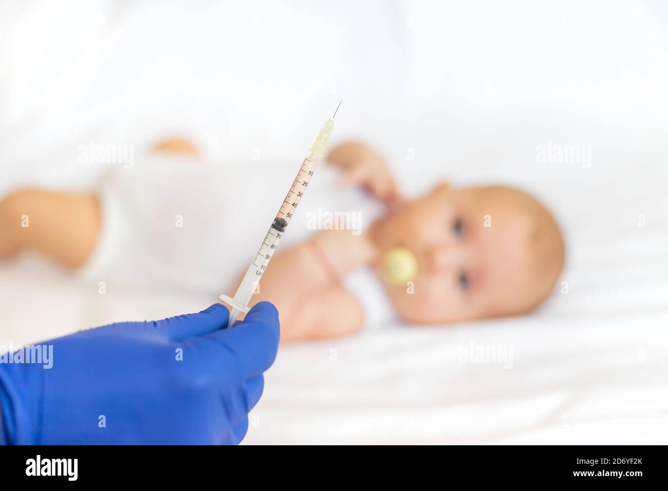 Vaccination baby, injection in the arm. Selective focus. People Stock ...