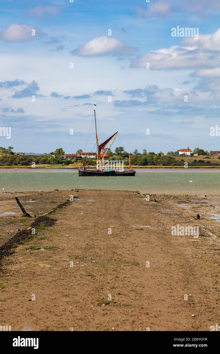 Views of Harty Ferry at low tide on a blustery summers day, a moored ...