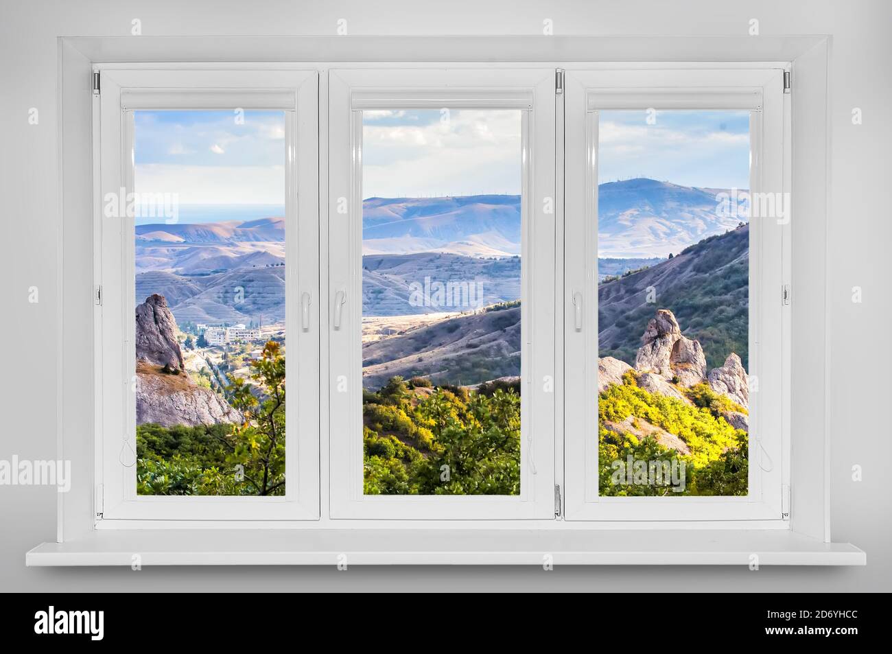 View from the window. Mountain forest landscape under evening sky with ...