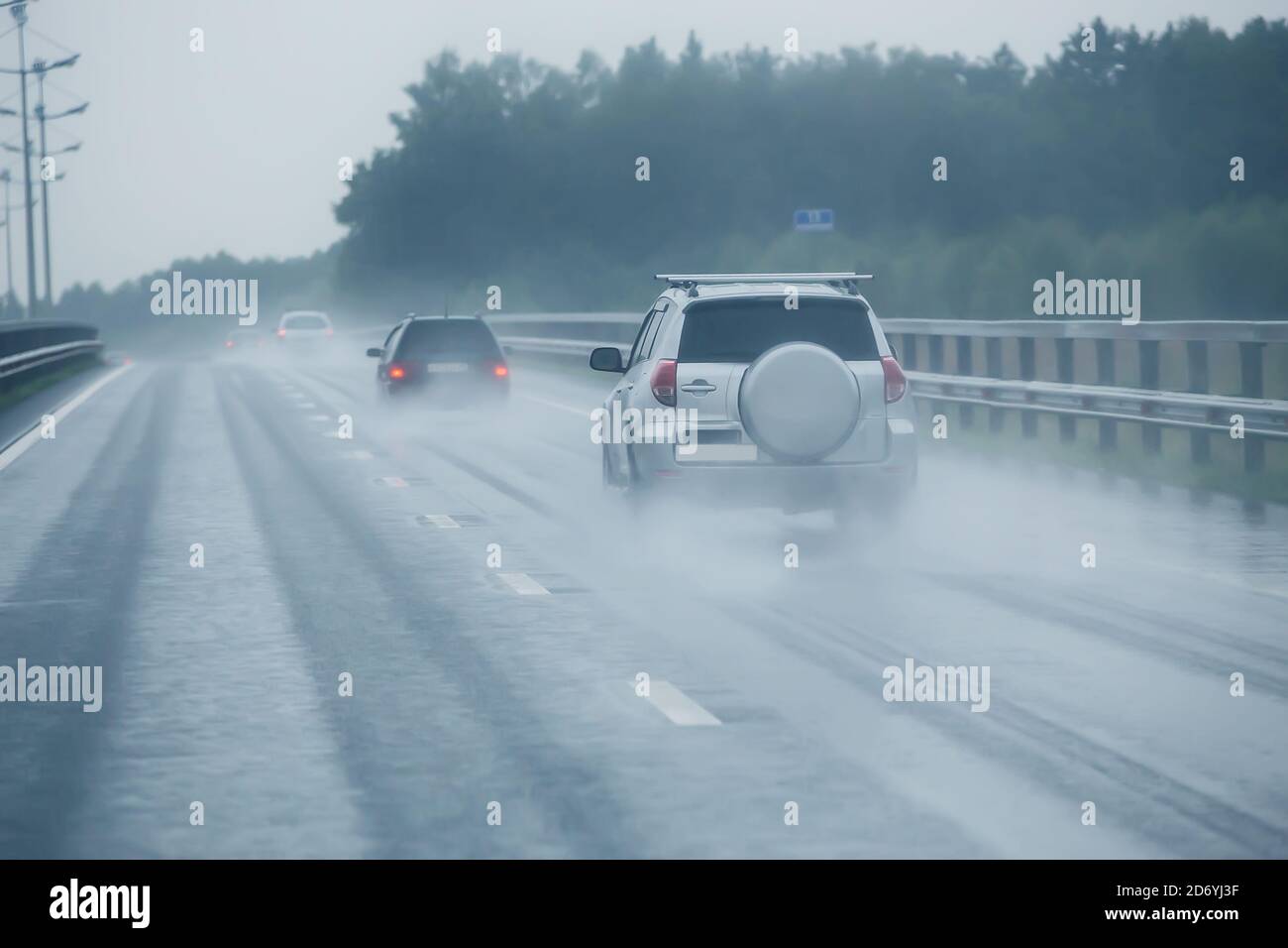 car traffic on highway during pouring rain Stock Photo - Alamy