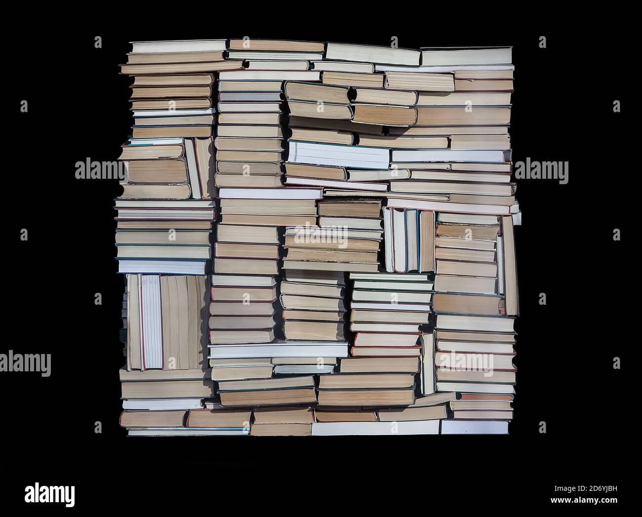 Stack of chaotically stacked books of different size and form. Isolated ...