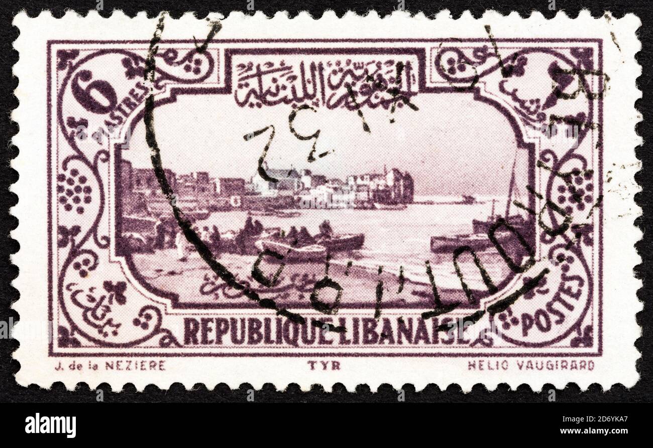LEBANON - CIRCA 1930: A stamp printed in Lebanon shows Tyre harbor ...