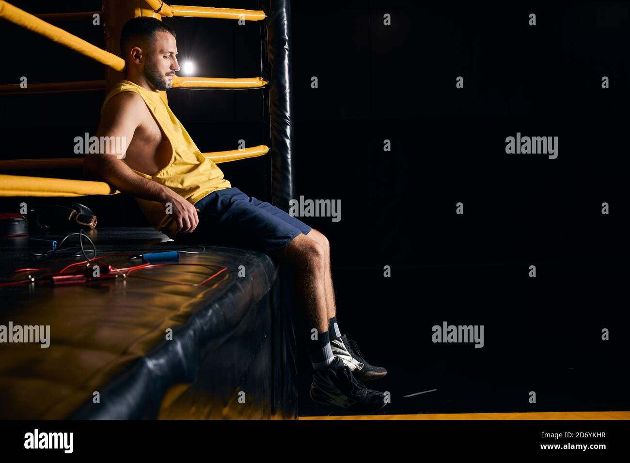 Tired boxer sitting on the side of the ring Stock Photo - Alamy