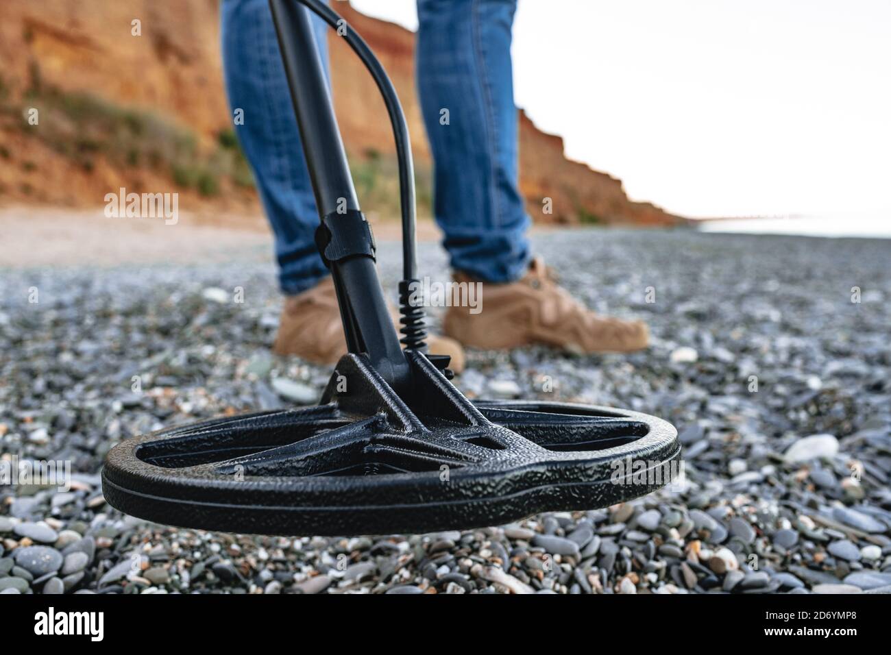 Metal detector coil in action above the ground Stock Photo - Alamy
