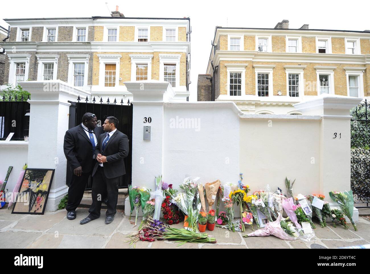Fans gather to lay tributes outside singer Amy Winehouse's house in ...