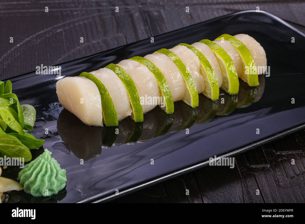 Japanese cuisine Sashimi with raw scallop Stock Photo - Alamy