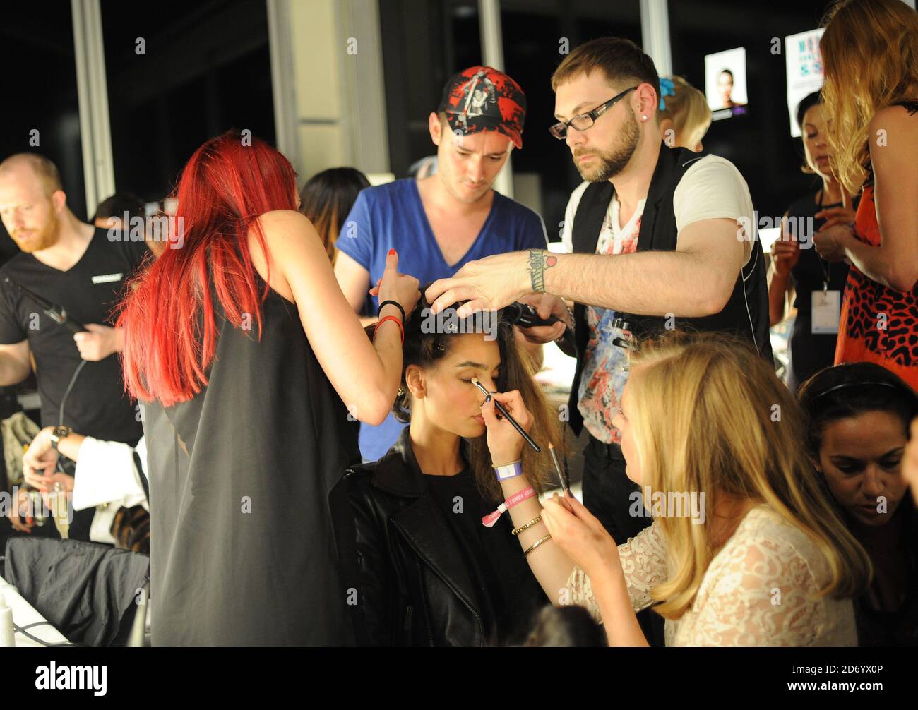 Models get their hair and makeup done for the Issa fashion show, held ...