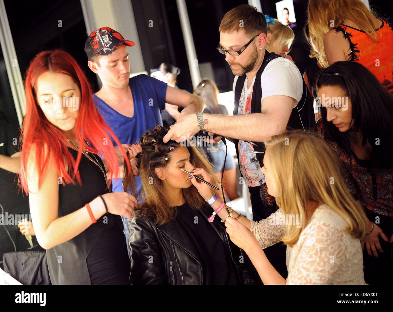 Models get their hair and makeup done for the Issa fashion show, held ...