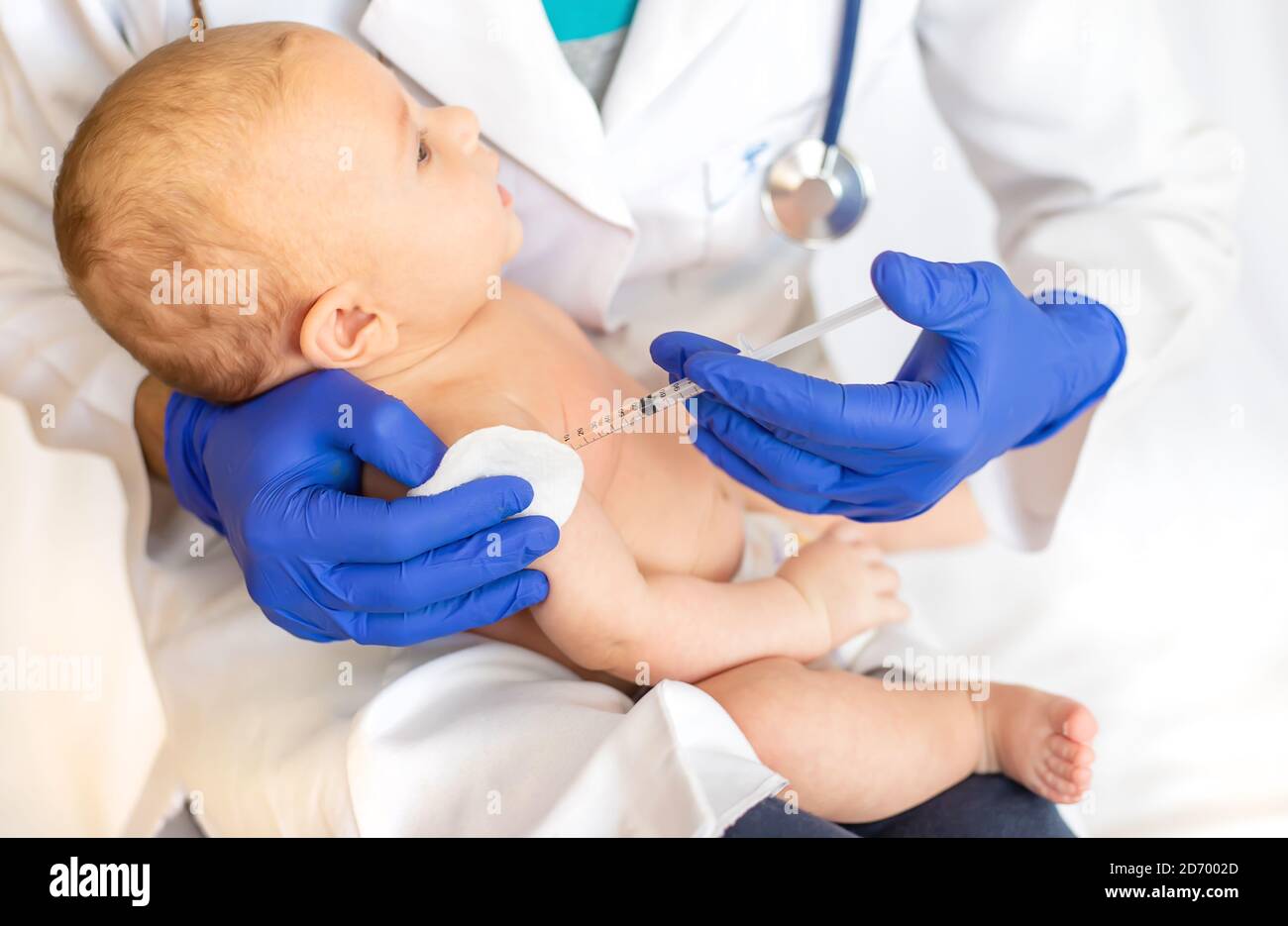 Vaccination baby, injection in the arm. Selective focus. People Stock ...