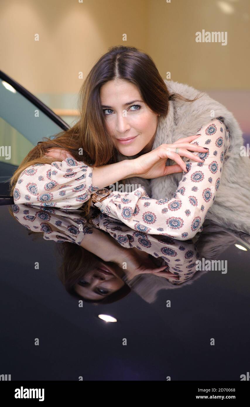 Lisa Snowdon is presented with the keys to a Lexus CT200h hybrid car ...