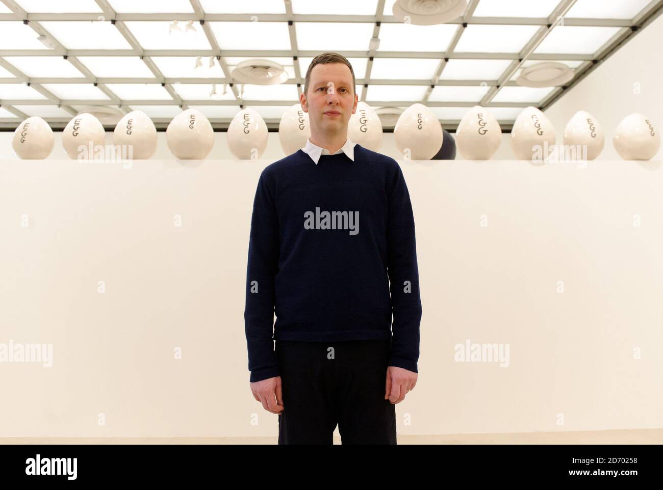 Artist David Shrigley pictured with his work Eggs, at the Hayward ...