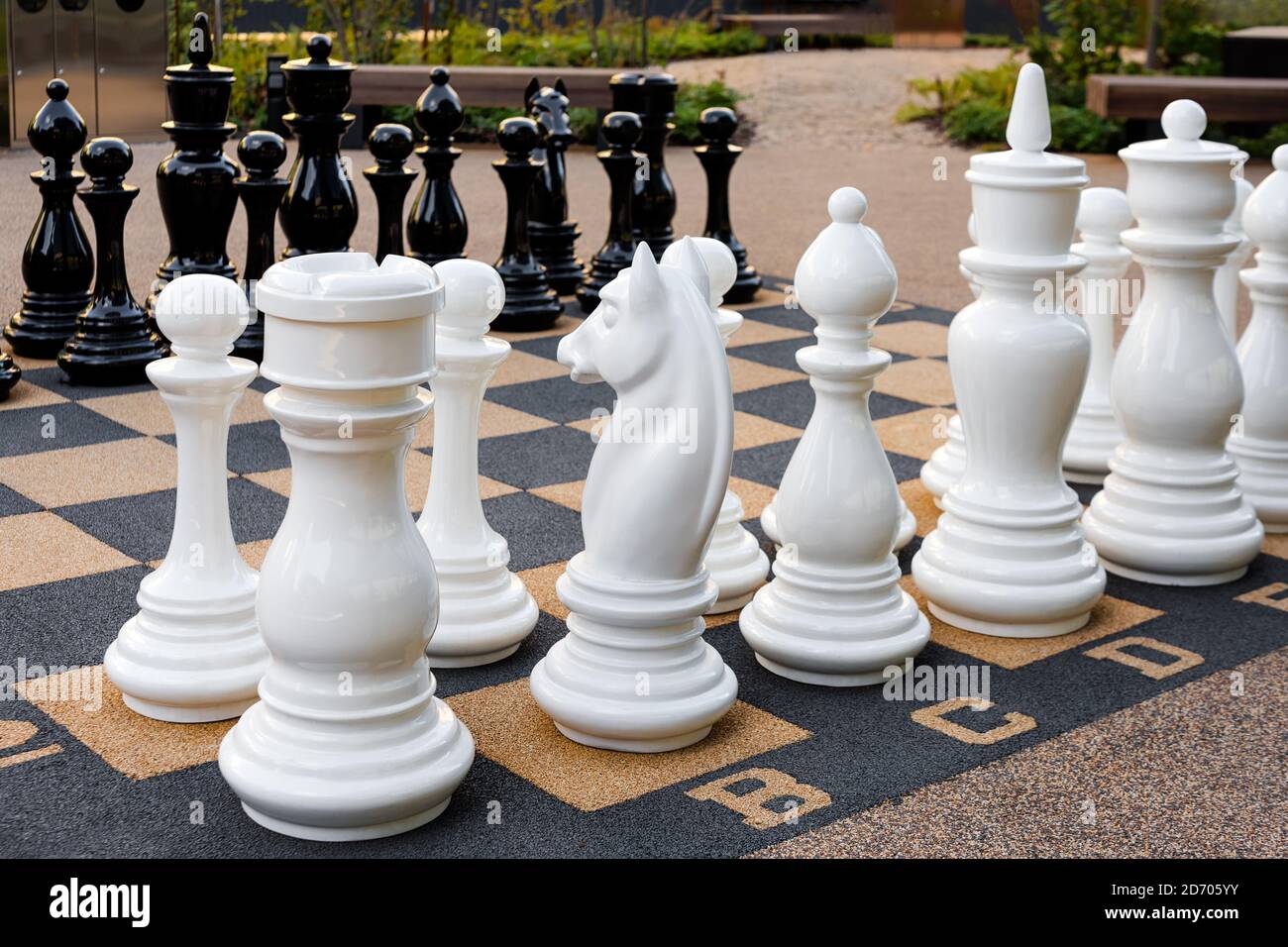 Outdoor chess board with big plastic pieces. Giant size chess in public ...