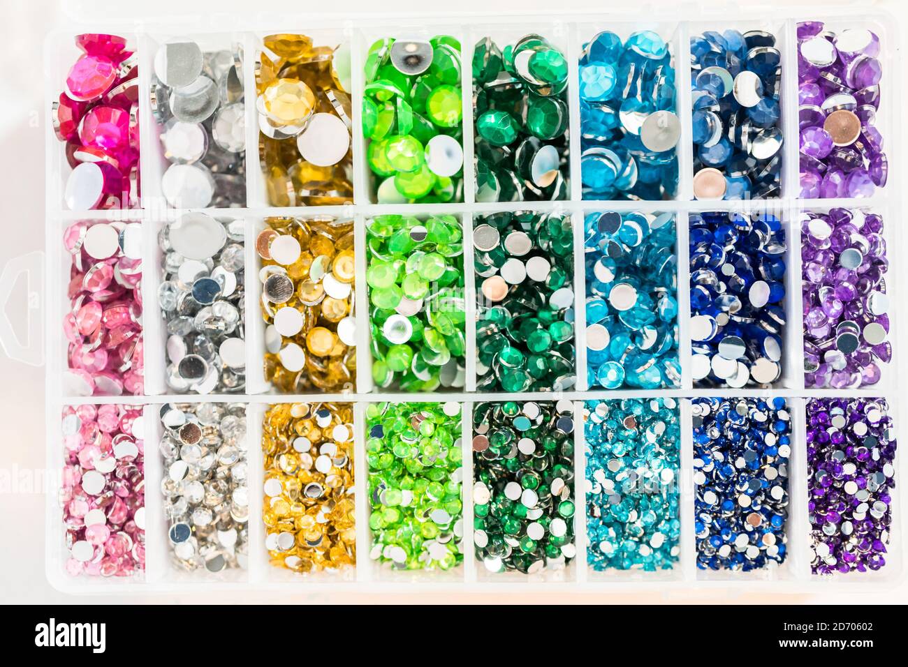 Color and size variety of rhinestones in the craft box Stock Photo - Alamy