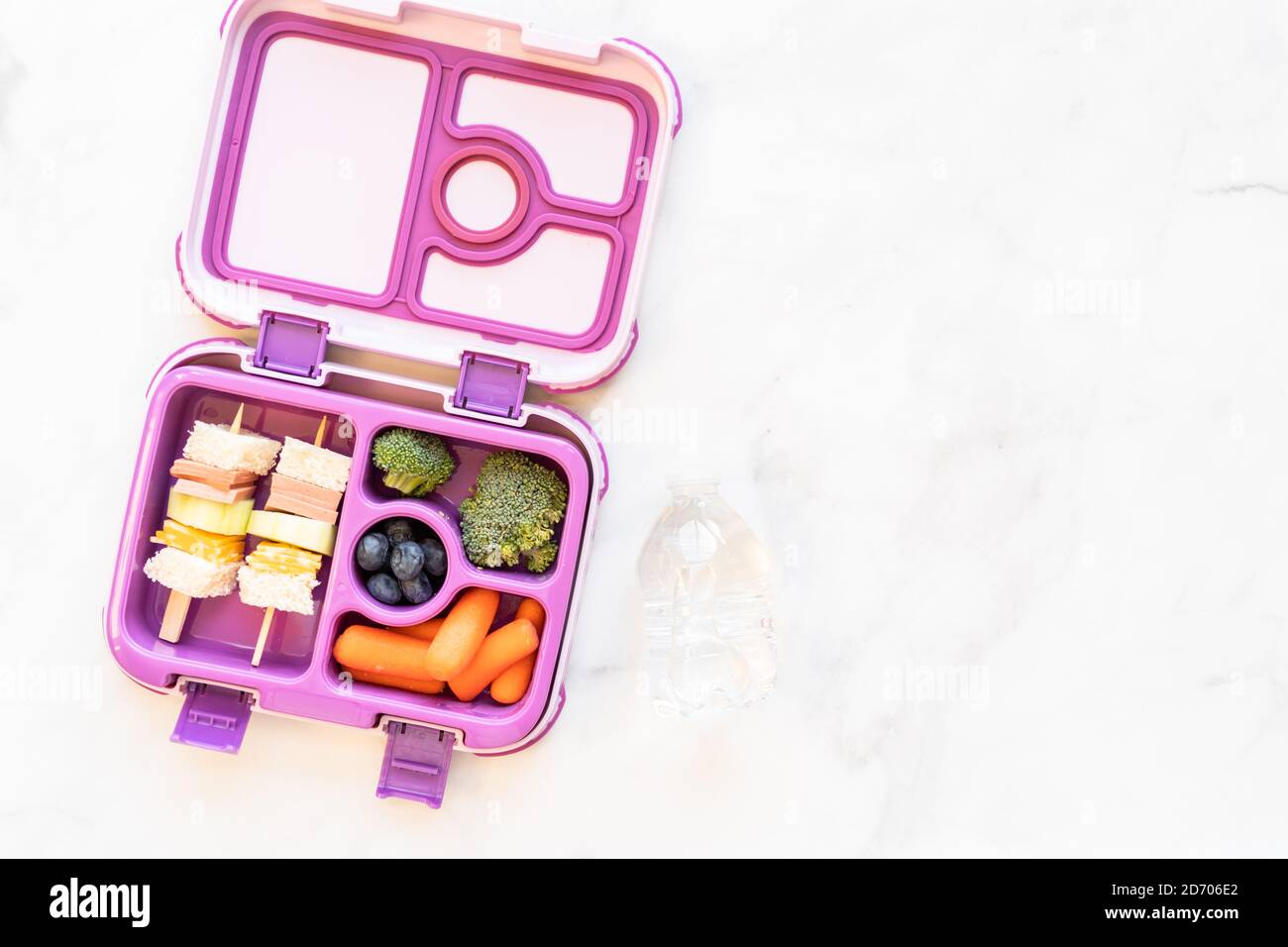 Flat lay. Healthy school lunch with kebab sandwich and vegetables in ...