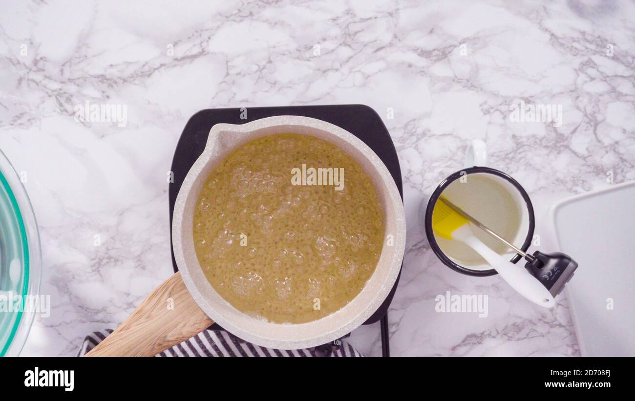 Flat lay. Step by step. Caramelizing sugar in a small cooking pot over ...