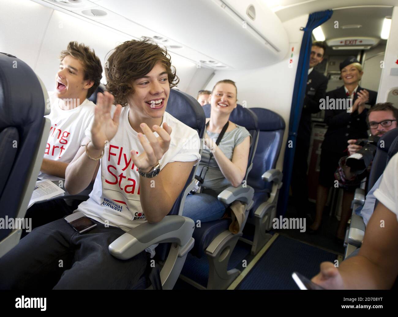 Liam Payne and Harry Styles of One Direction pictured on board flight ...