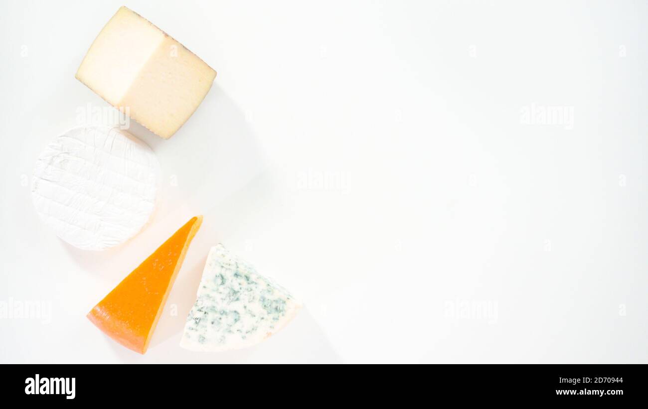 Flat lay. Large slice of gourmet cheese on a white background Stock ...