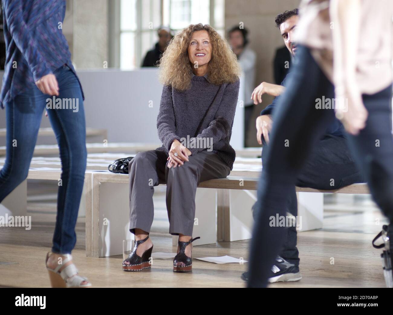 Designer Nicole Farhi watches models rehearse before her fashion show ...