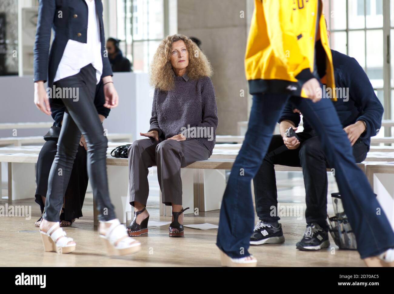 Designer Nicole Farhi watches models rehearse before her fashion show ...