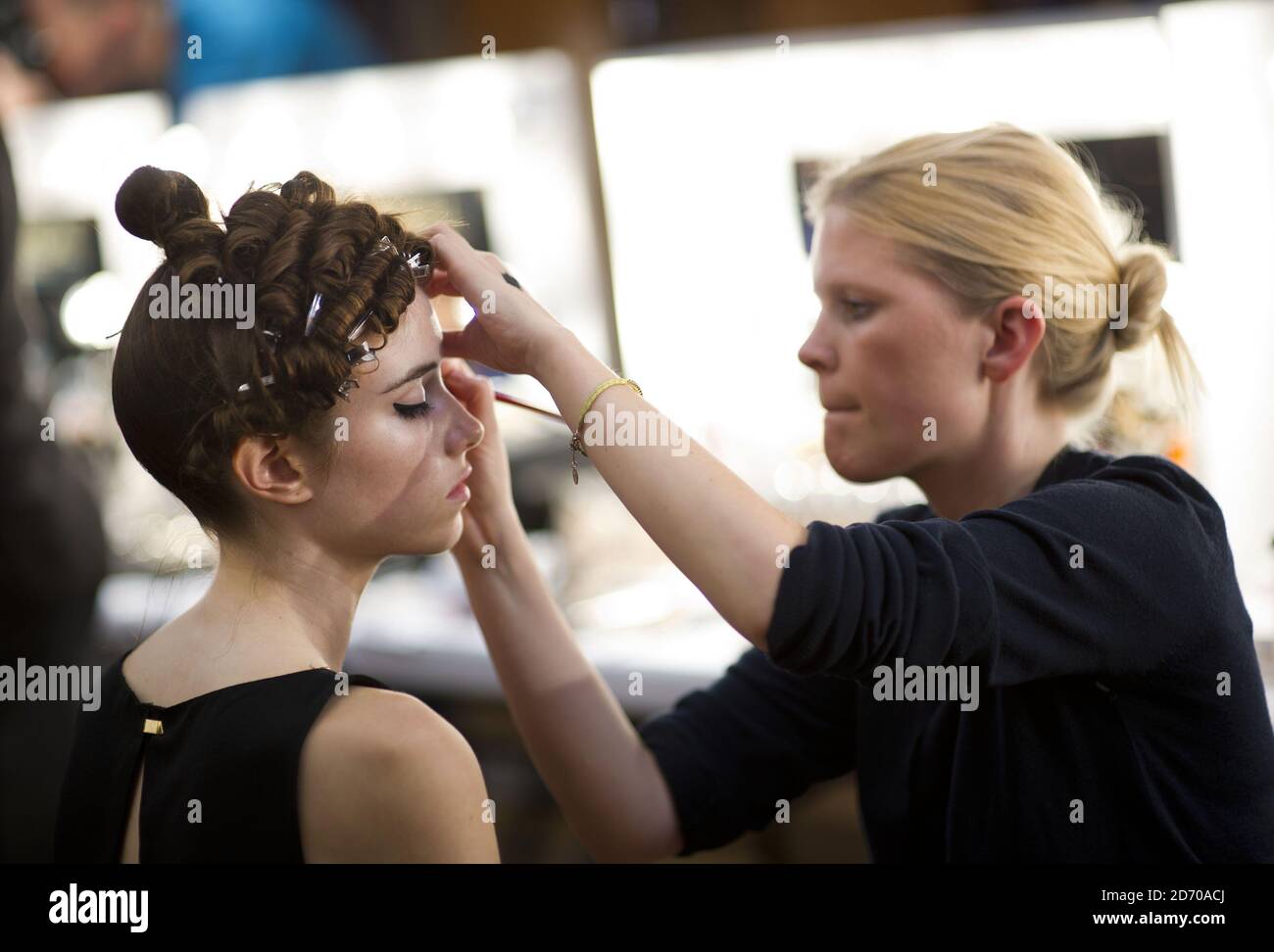Models prepare backstage before the Temperley fashion show, held at the ...