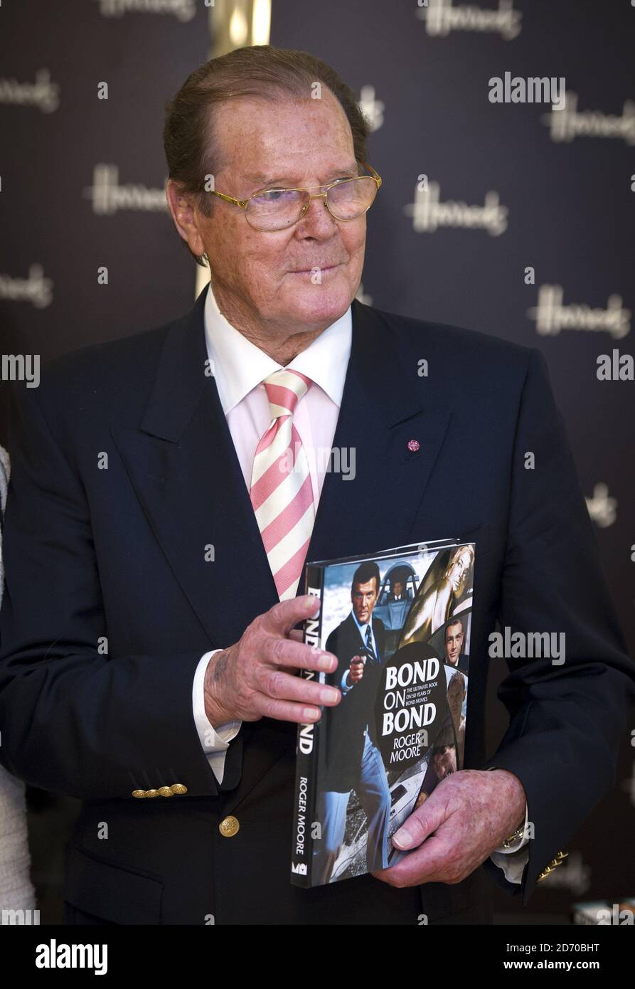 Roger Moore signs copies of his book, Bond on Bond, at Harrod's in West ...